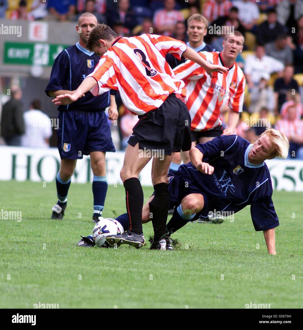Mansfield Towns Craig Disley (right) battles for the ball with ...