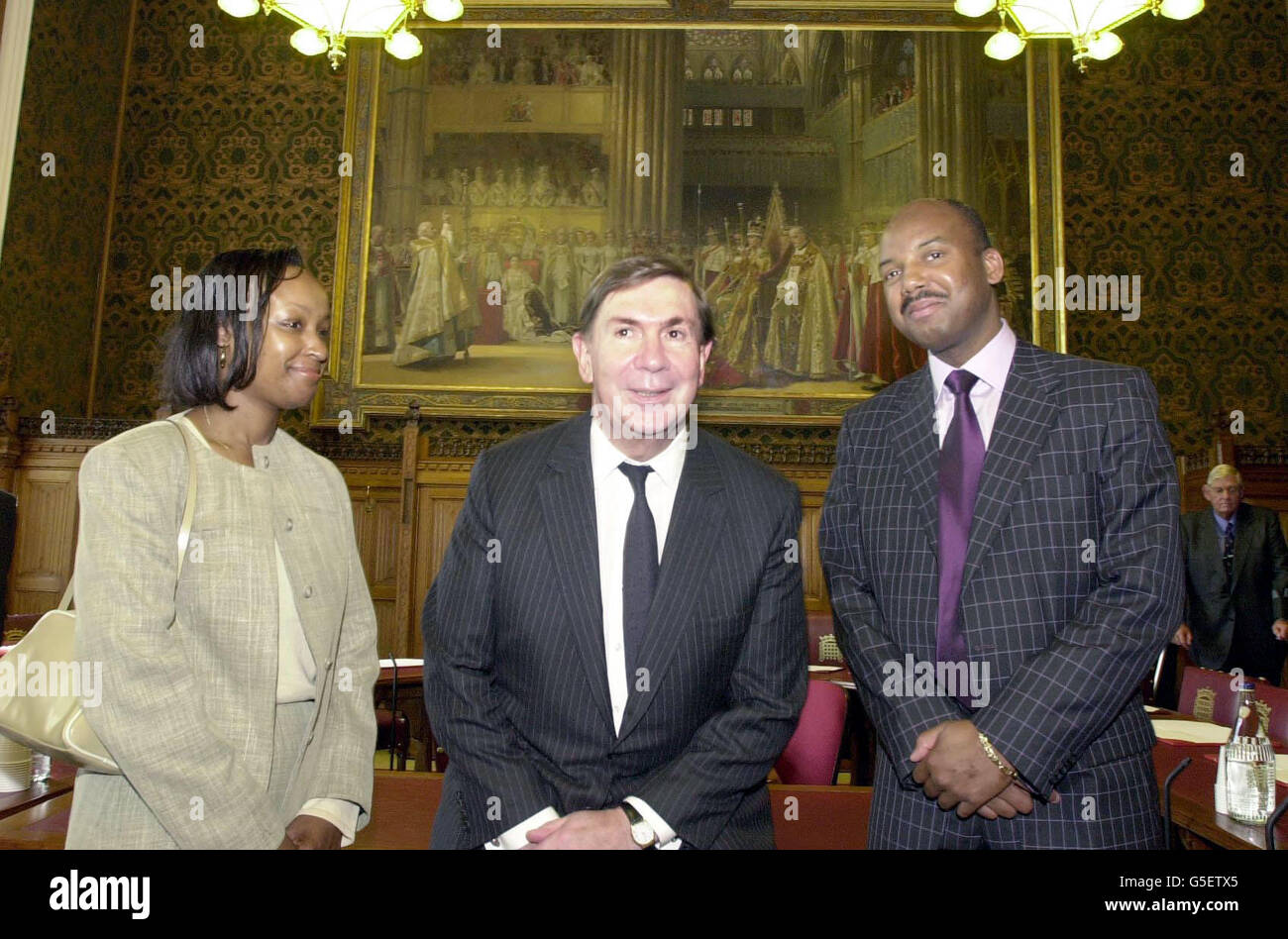 The Lord Chancellor, Lord Irvine (C) talks with Community Ambassador ...