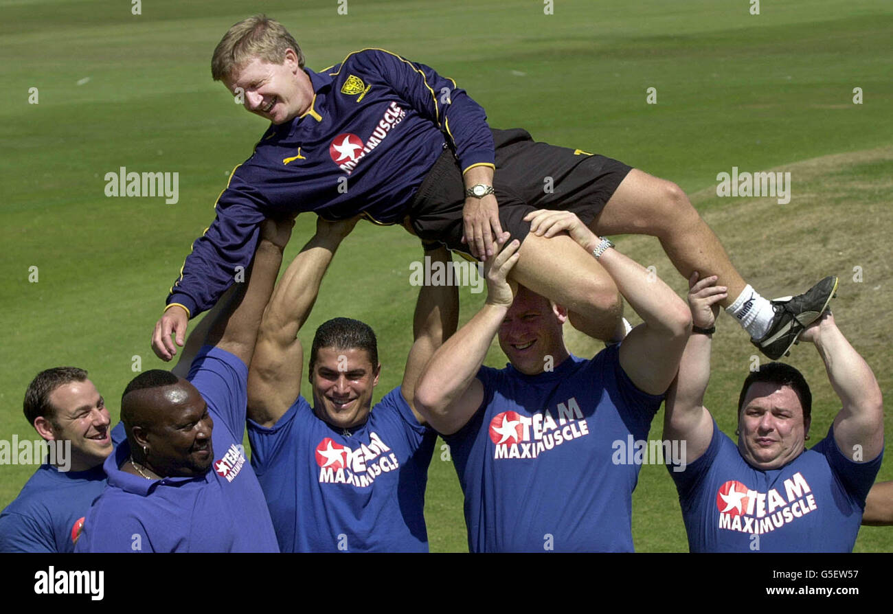 Wimbledon Manager Terry Burton is lifted by Maximuscle sponsored strong ...