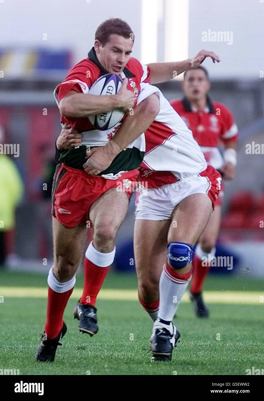 Wales' Ian Watson (left) is challenged by England's Keith Senior during ...
