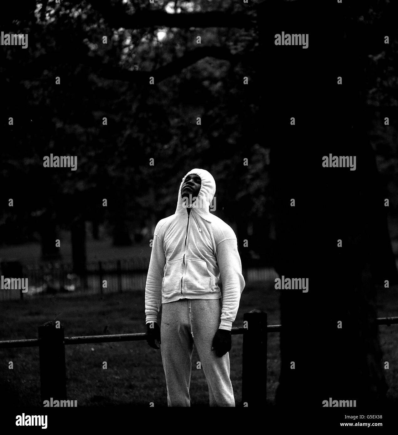 Boxer Cassius Clay rests during an early morning run in London's Hyde ...