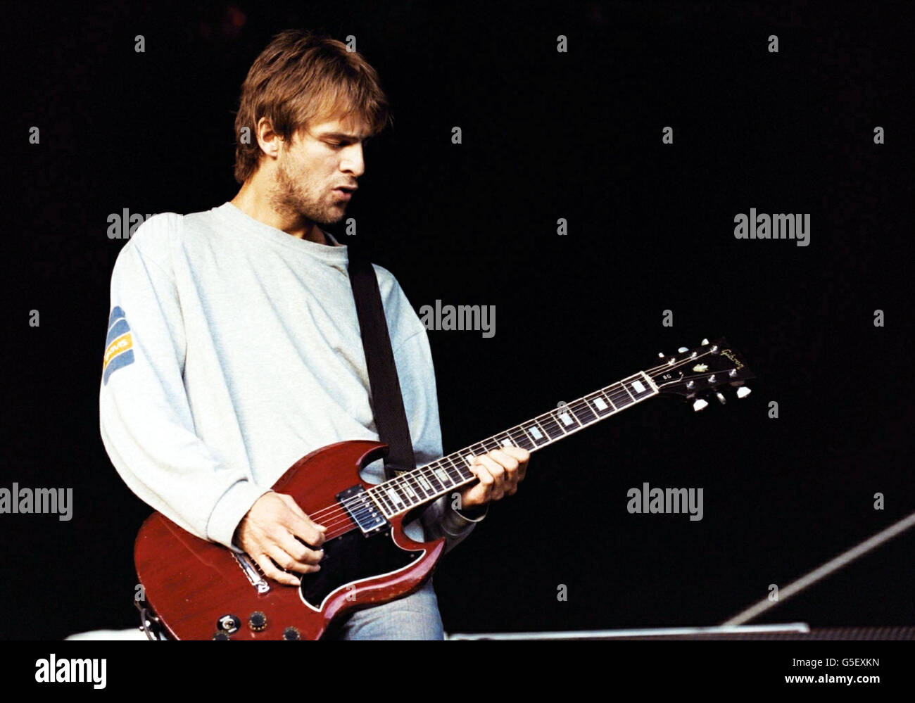 Kenwyn House, guitar player from the band Reef, performs on stage at ...