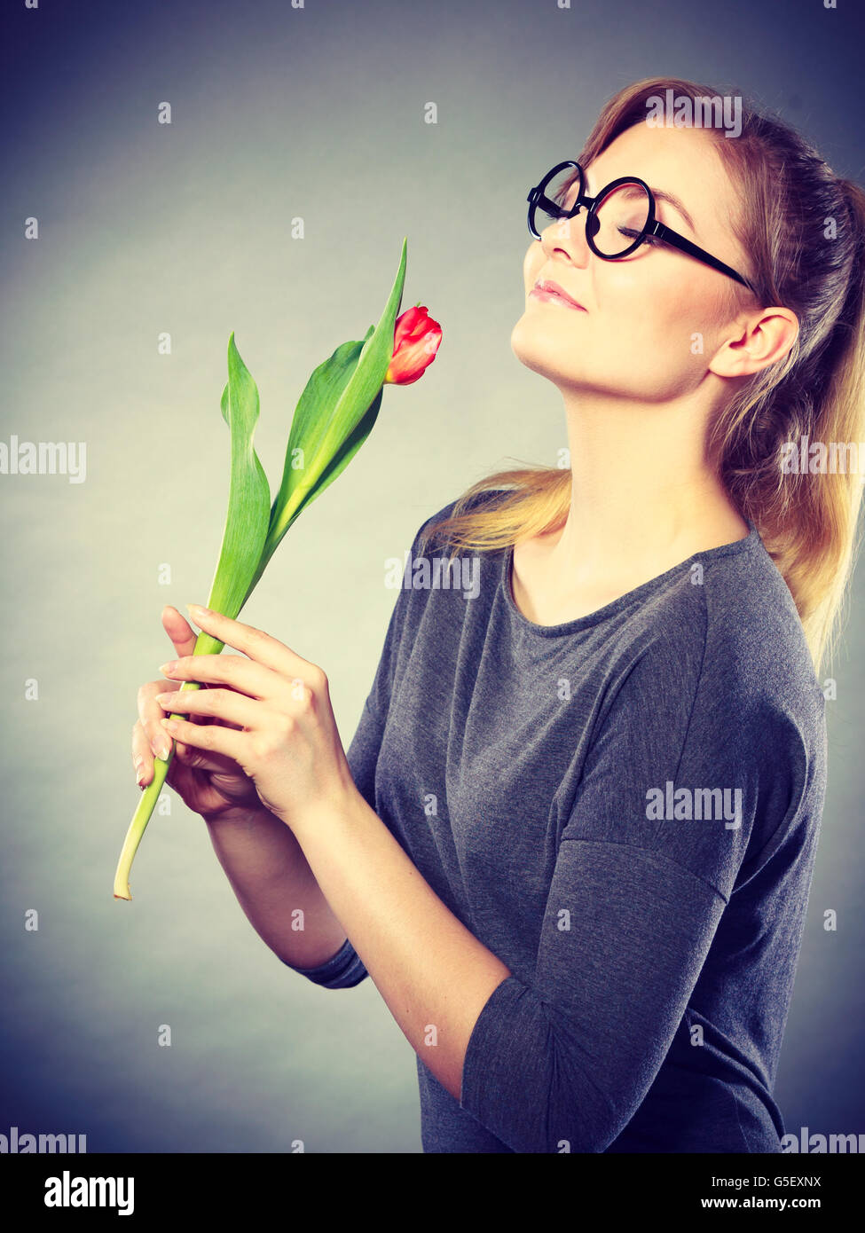 Peace and content. Beauty adorable girl smelling beautiful spring ...
