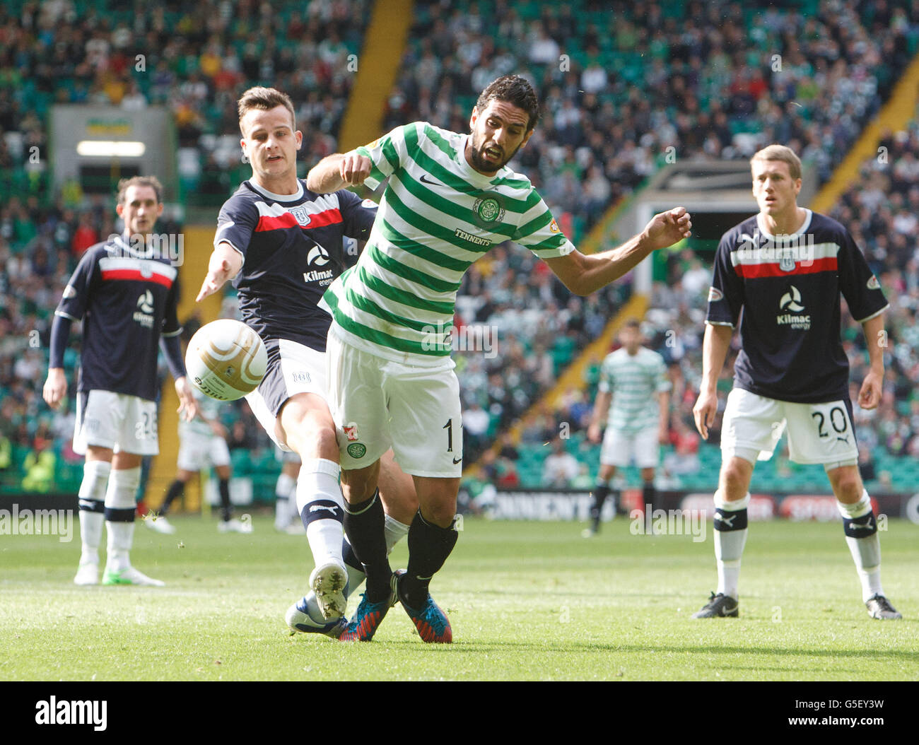 Celtic's Lassad Nouioui is fouled by Dundee's Kyle Benedictus for a ...