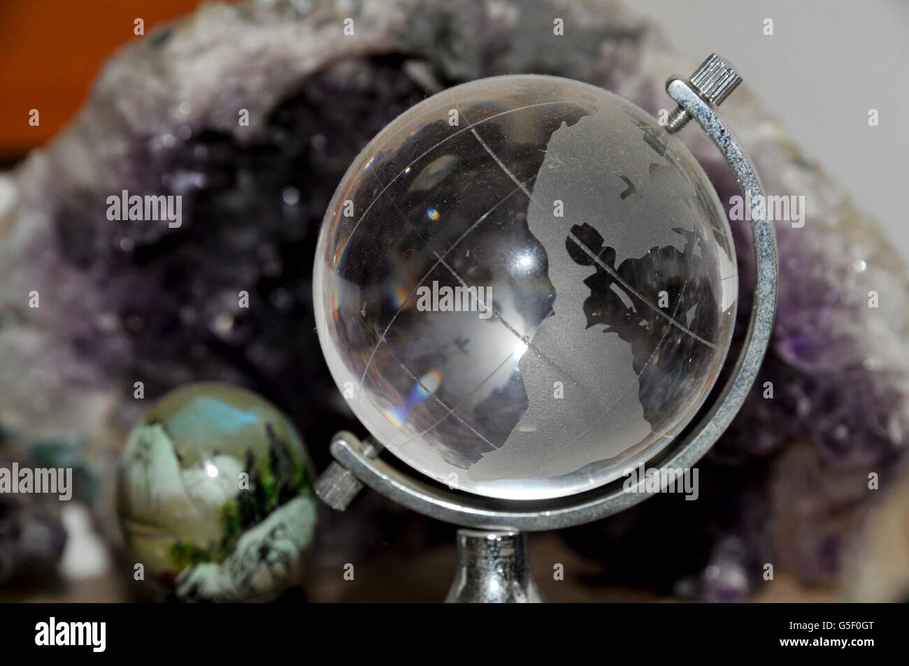 Map of the world etched in a glass globe Stock Photo - Alamy