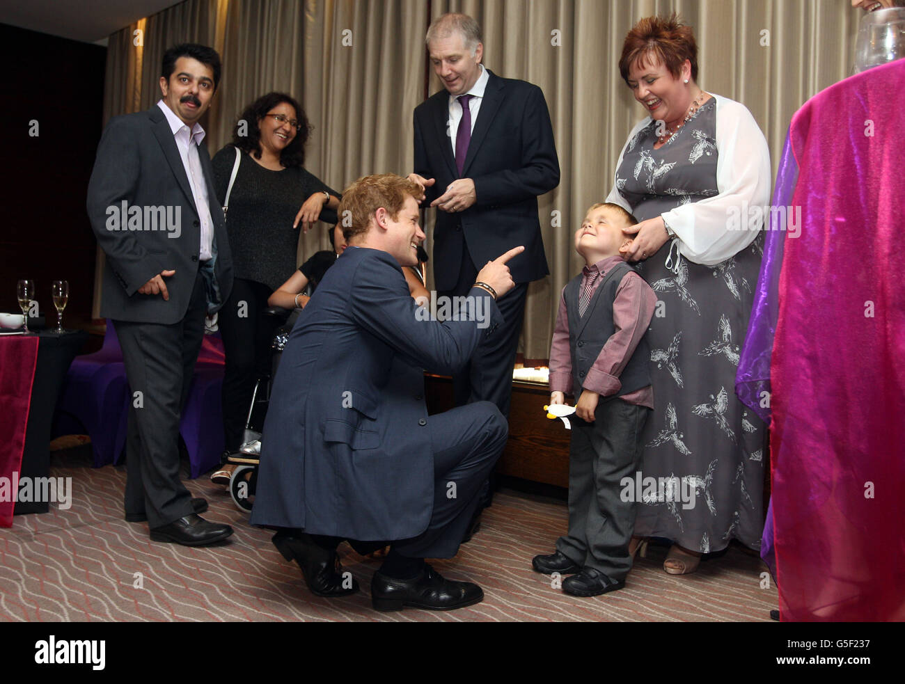 Prince Harry talks to Alex Logan as he attends the WellChild awards ...