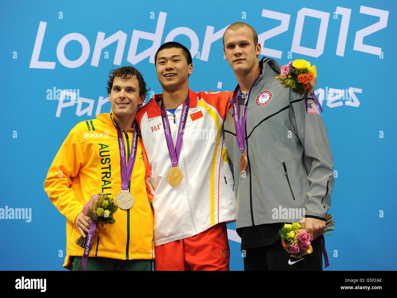 China's Shiyun Pan (centre) on the podium with his gold medal ...
