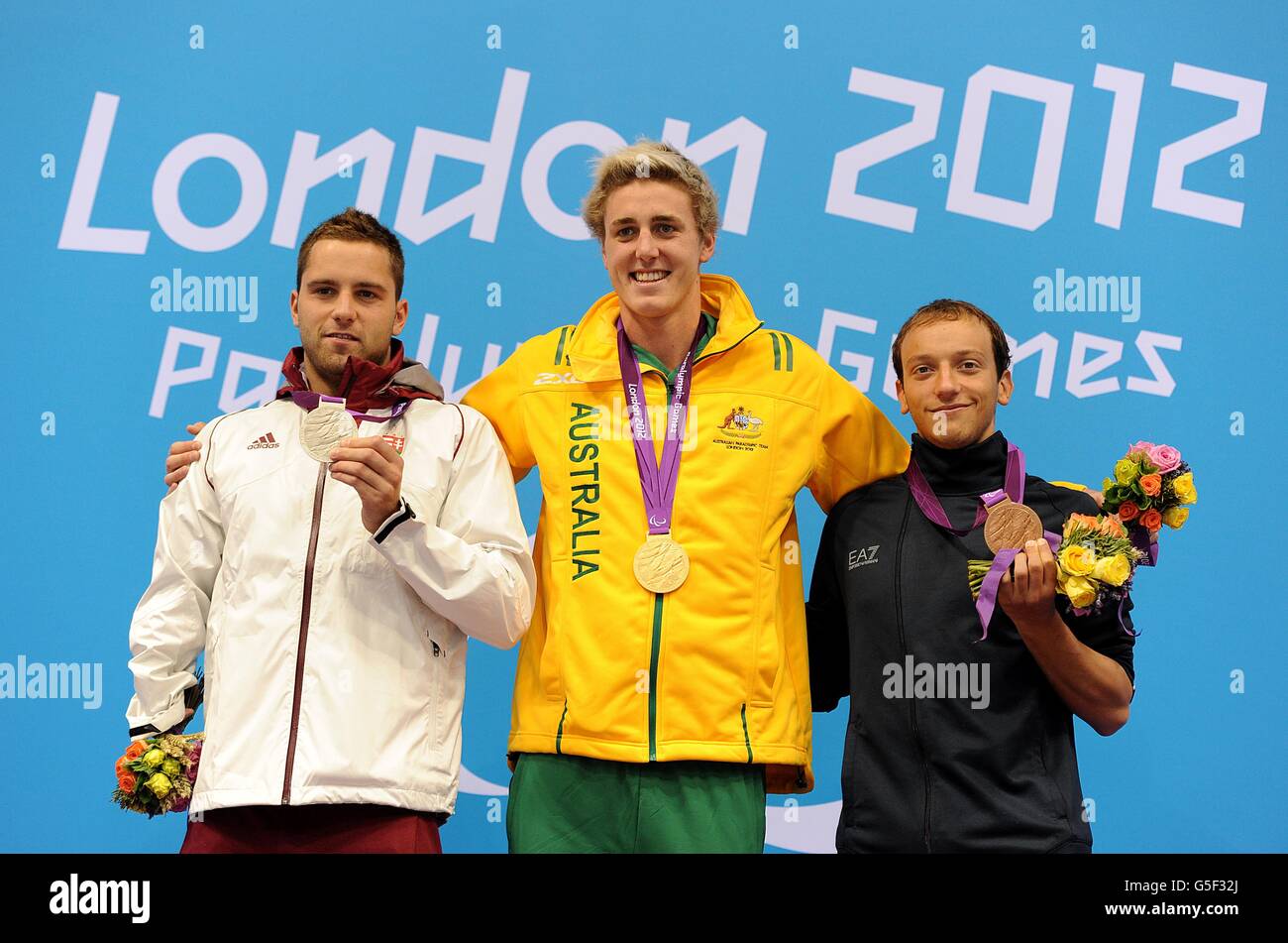 Australia's Brendan Hall (centre) on the podium with his gold medal ...