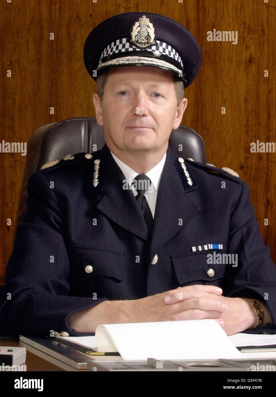 Strathclyde Police's new Chief Constable Willie Rae sits at his desk on ...