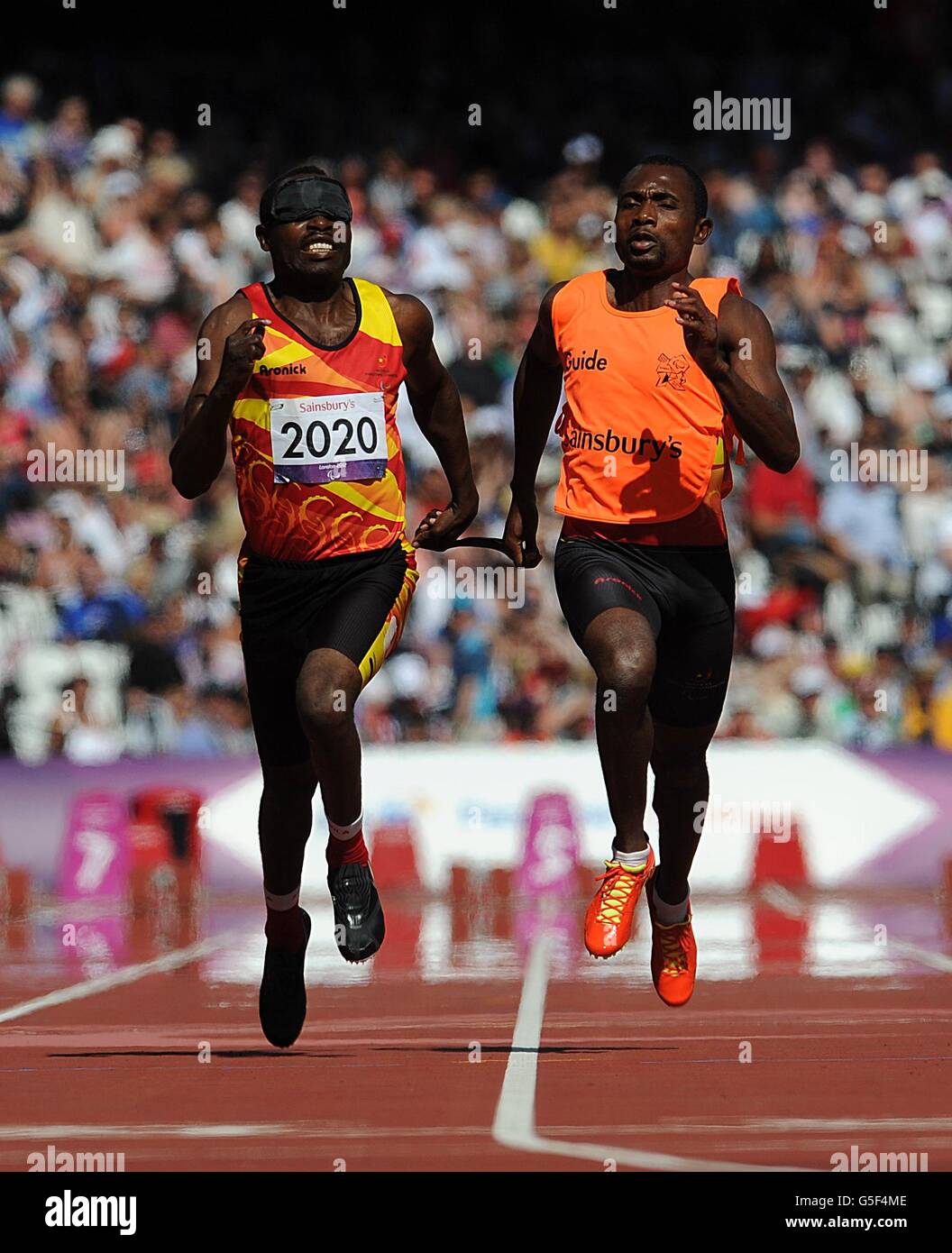 London Paralympic Games - Day 9. Angola's Jose Sayovo Armando and Guide ...