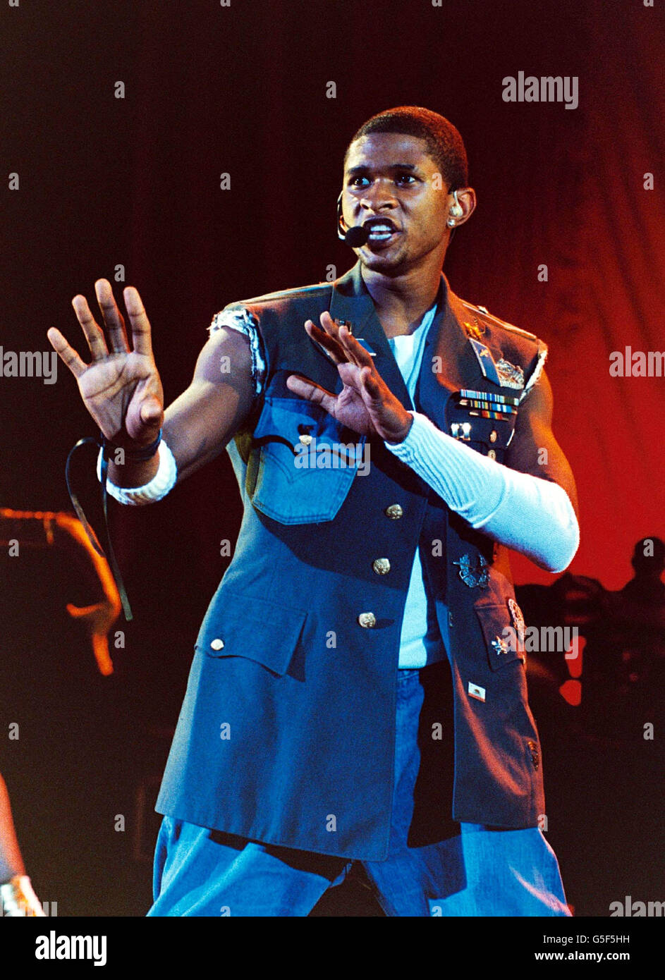 Singer Usher performing on stage at the Hammersmith Apollo, London ...