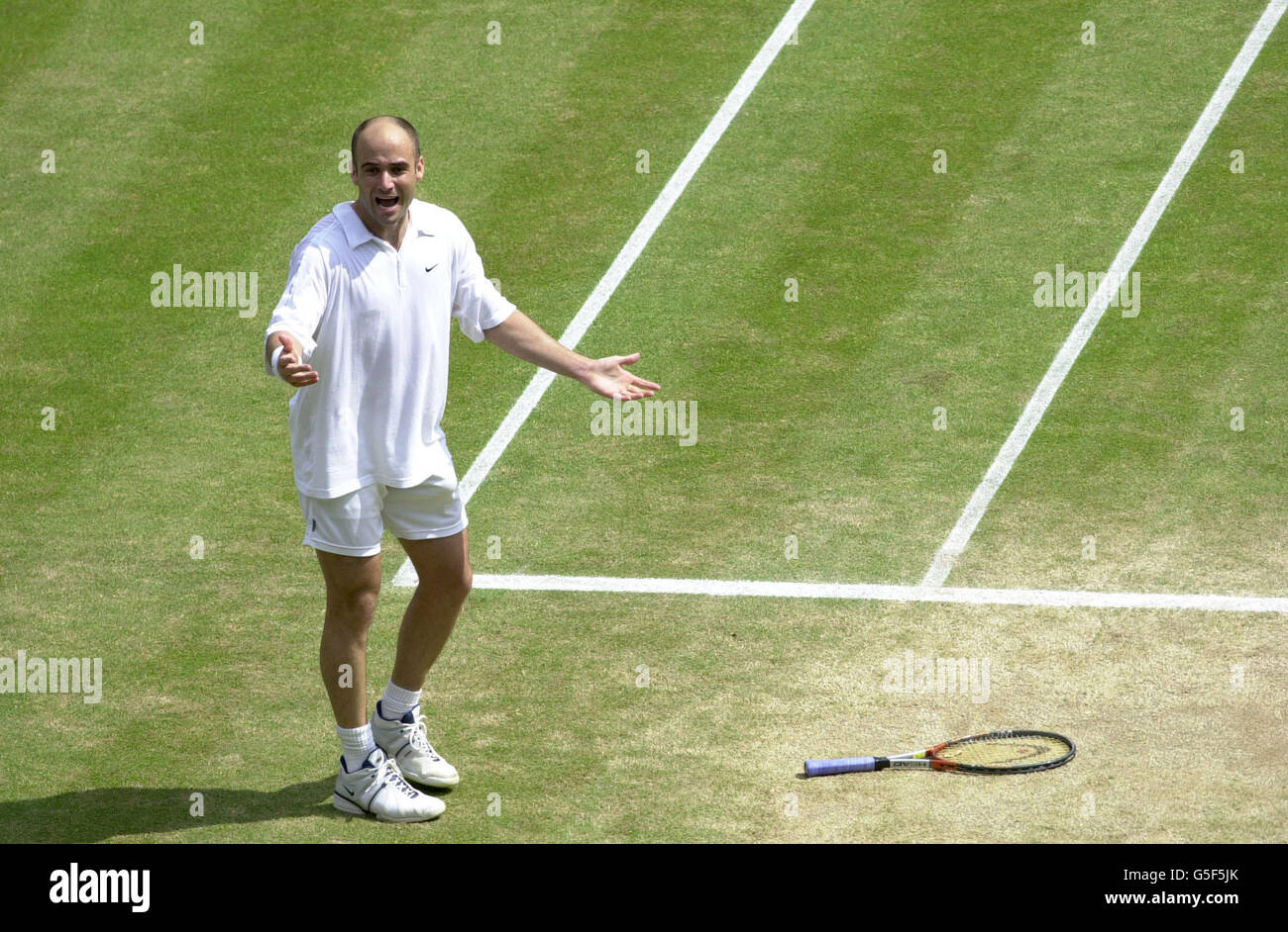 Tennis angry racket arms raised andre agassi hi-res stock photography ...