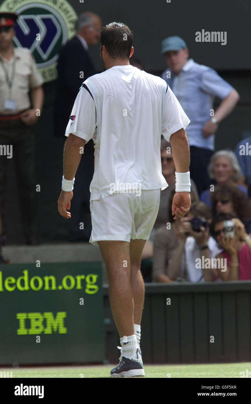 NO COMMERCIAL USE : A very sweaty Pat Rafter takes a break during his ...