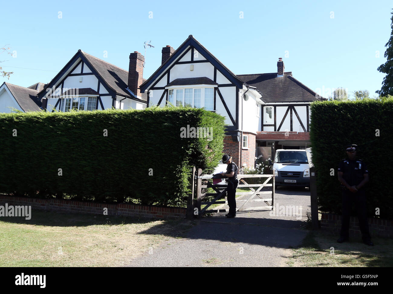Police at the home of French shooting victim, Saad al-Hilli in Claygate ...