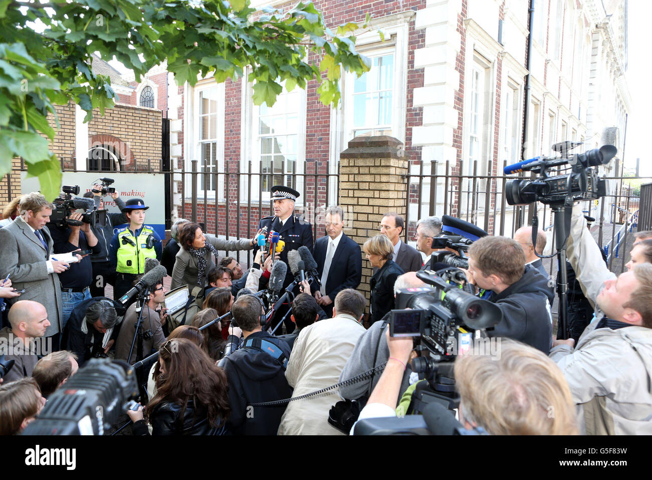 Surrey Police Assistant Chief Constable Rob Price (left) with examining ...