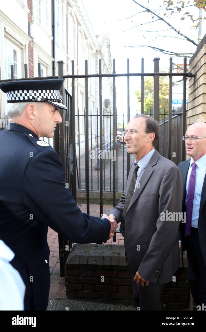 Surrey Police Assistant Chief Constable Rob Price (left) greets ...