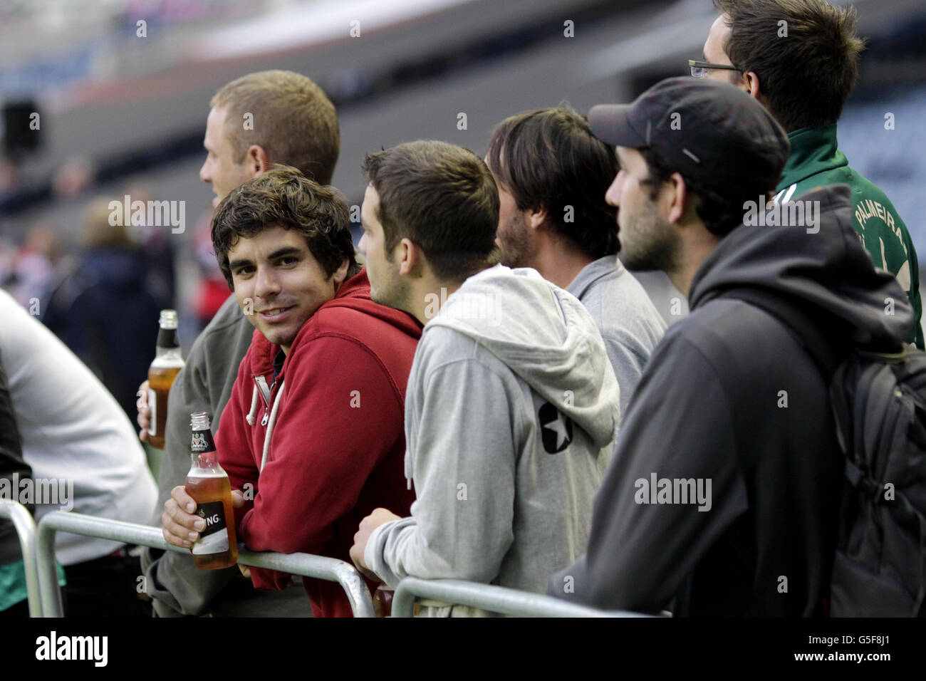 Fans enjoy refreshments in the stand before the game between Edinburgh ...