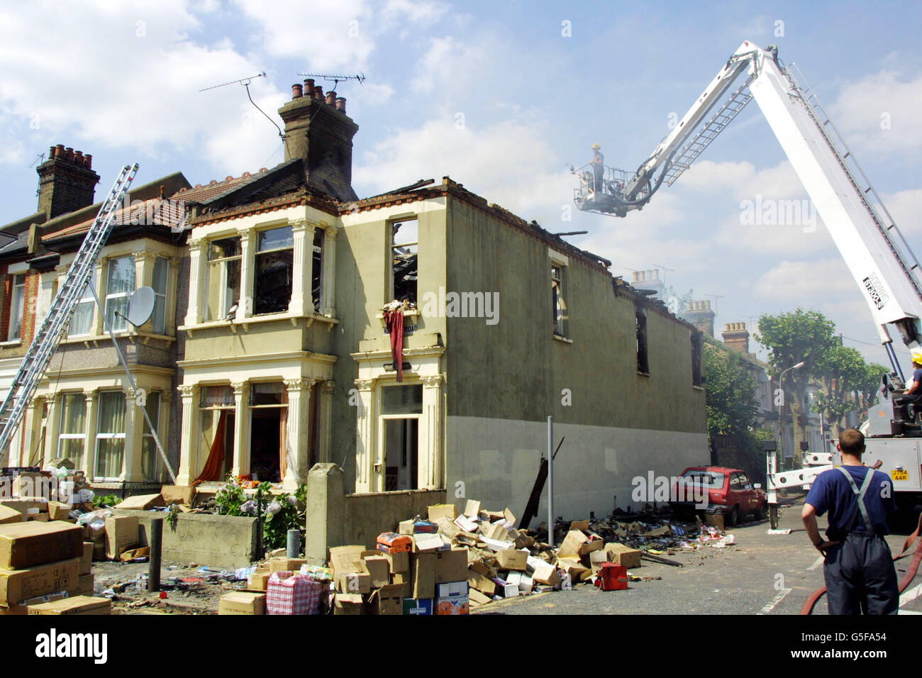 Firefighters from Southend and Canvey Fire Brigade dampen down the ...