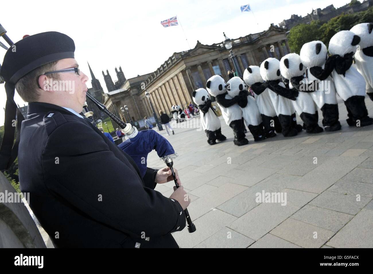 Performers in panda costumes on Princes Street, Edinburgh, Scotland to ...