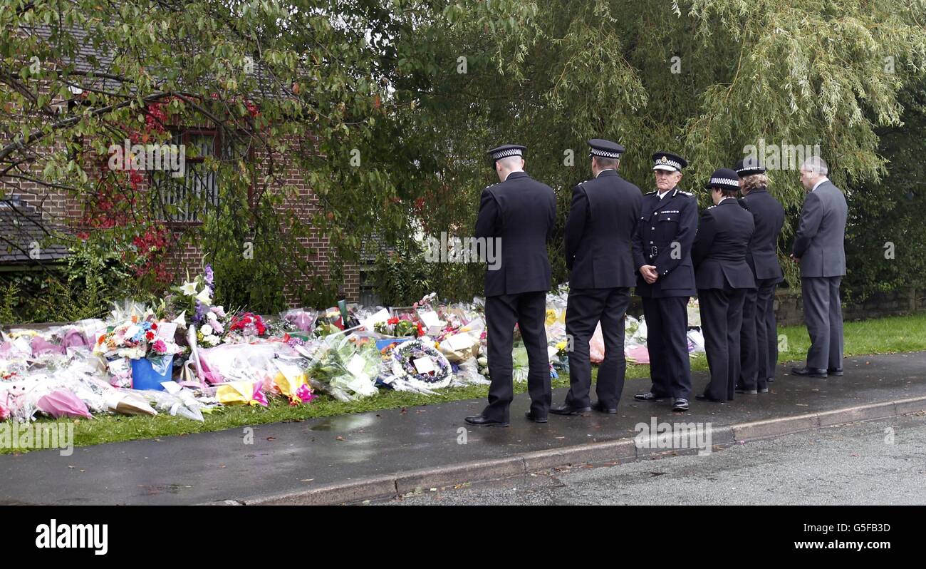 Greater Manchester Chief Constable Sir Peter Fahy (third left) pauses ...