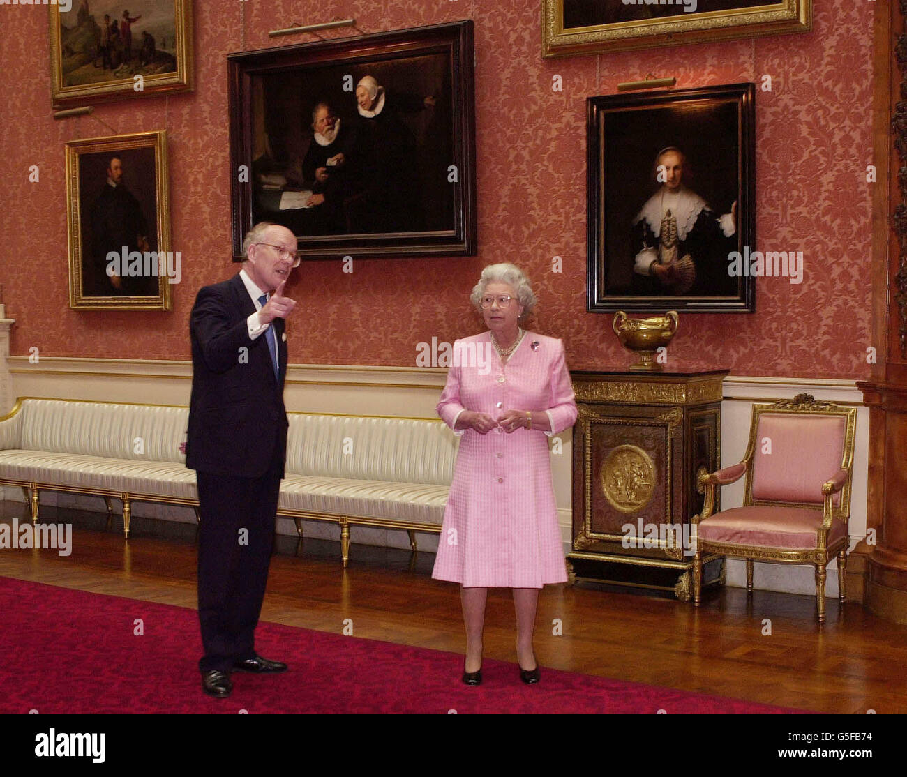 Queen Elizabeth II of Great Britain, accompanied by Sir Hugh Roberts ...