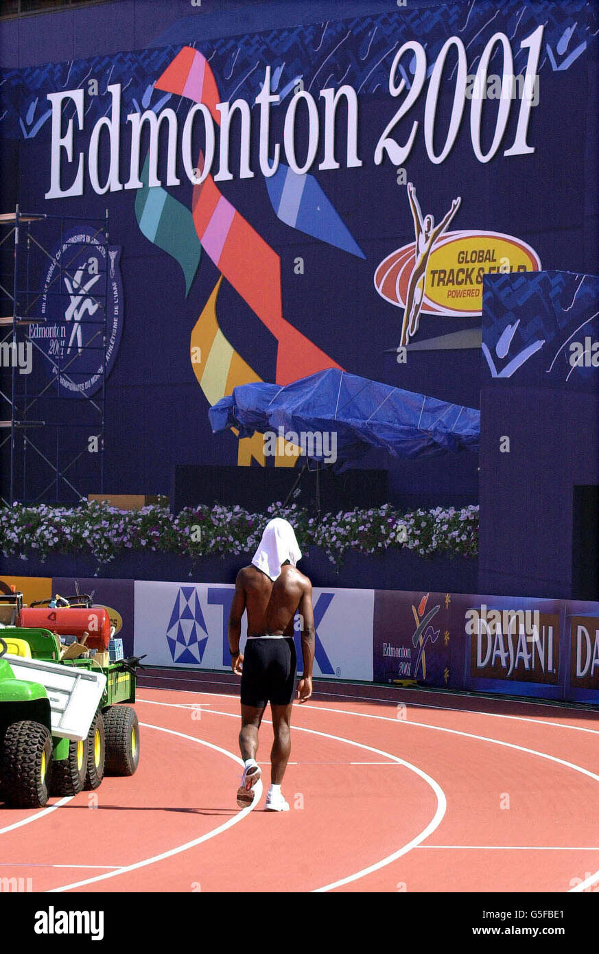 World and Olympic champion Michael Johnson from the US walks past a ...