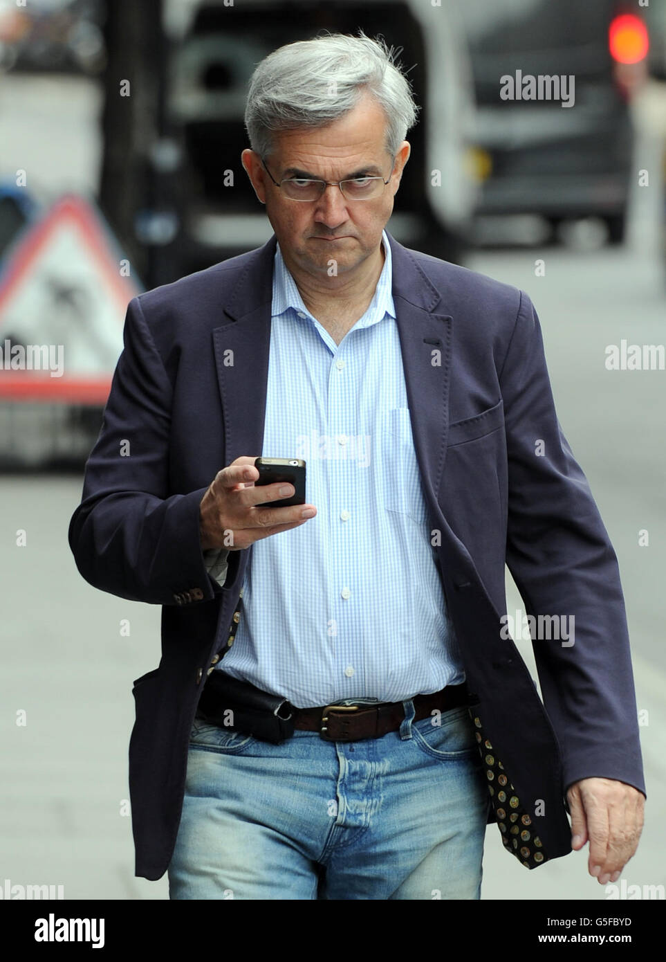 Lib dem mp chris huhne walks through city london hi-res stock ...