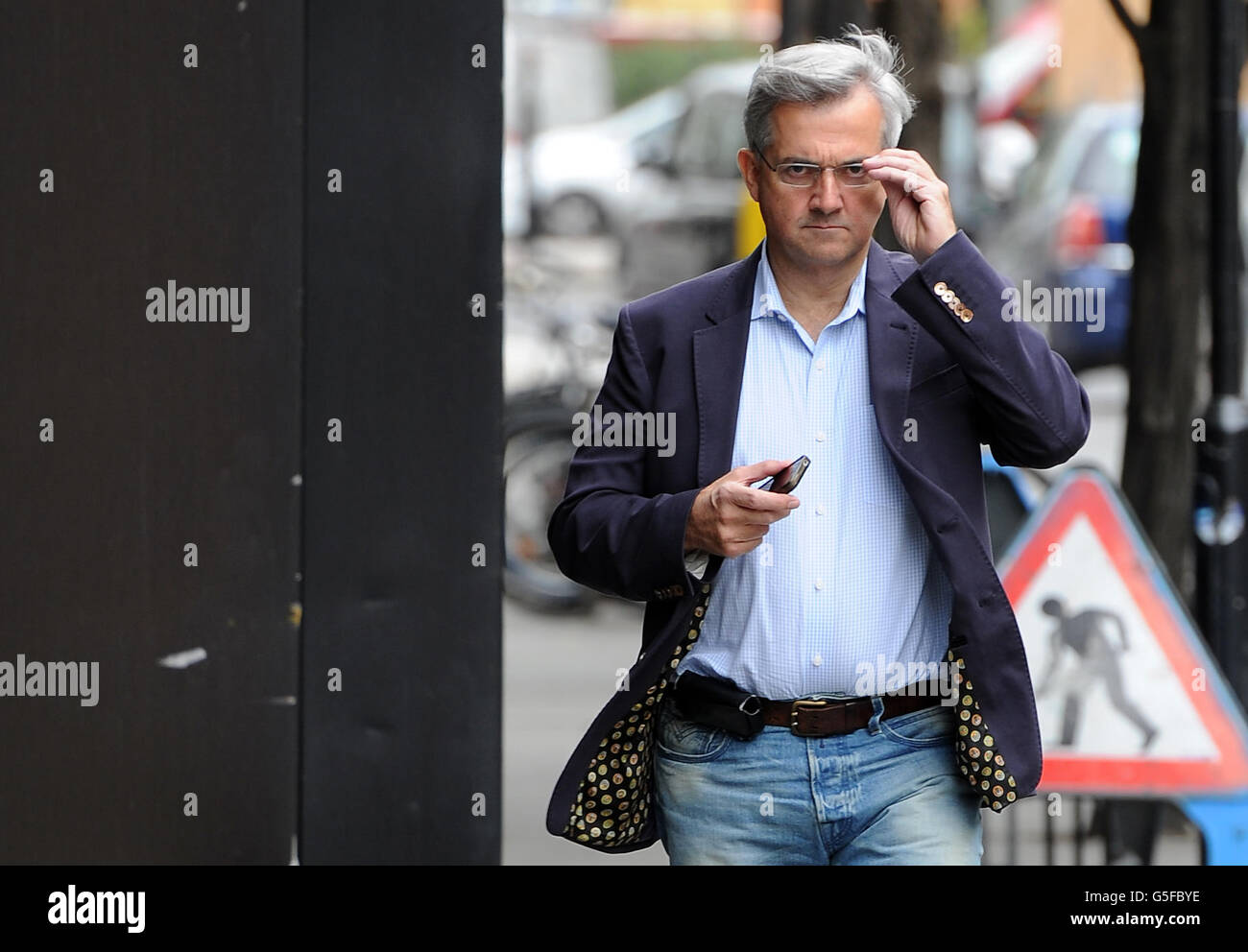 Lib dem mp chris huhne walks through city london hi-res stock ...