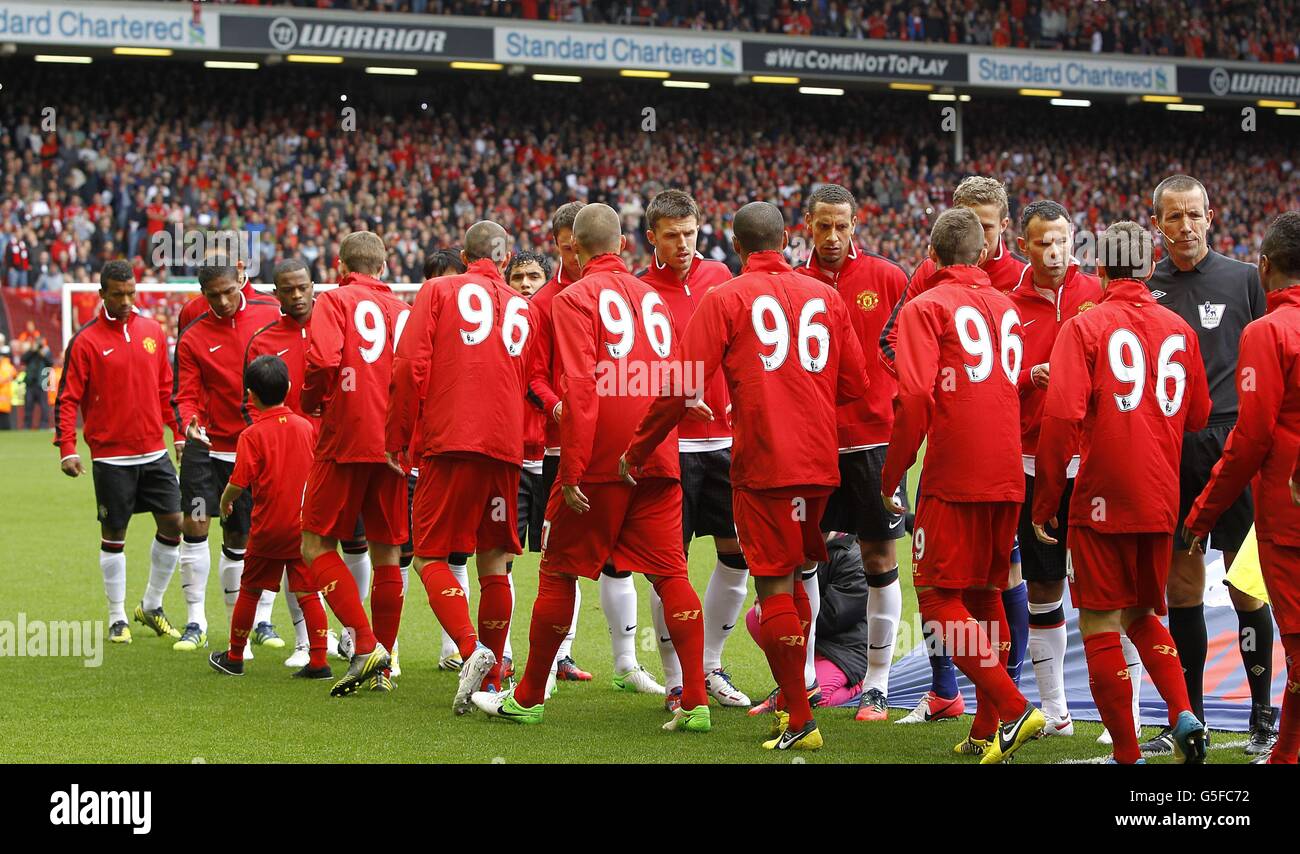 Liverpool and Manchester United players shake hands prior to kick-off ...