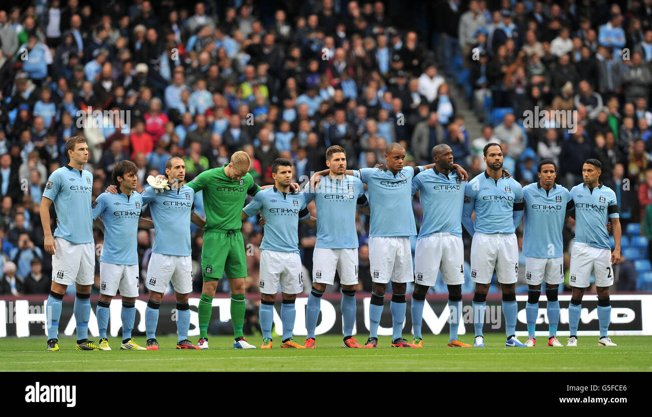 Manchester City line up for a minutes applause for the 2 shot ...