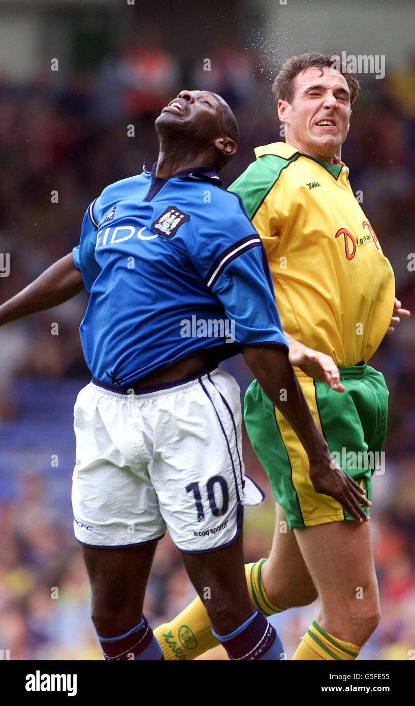 . Manchester City's Shaun Goater clashes with Norwich's Malky Mackay ...