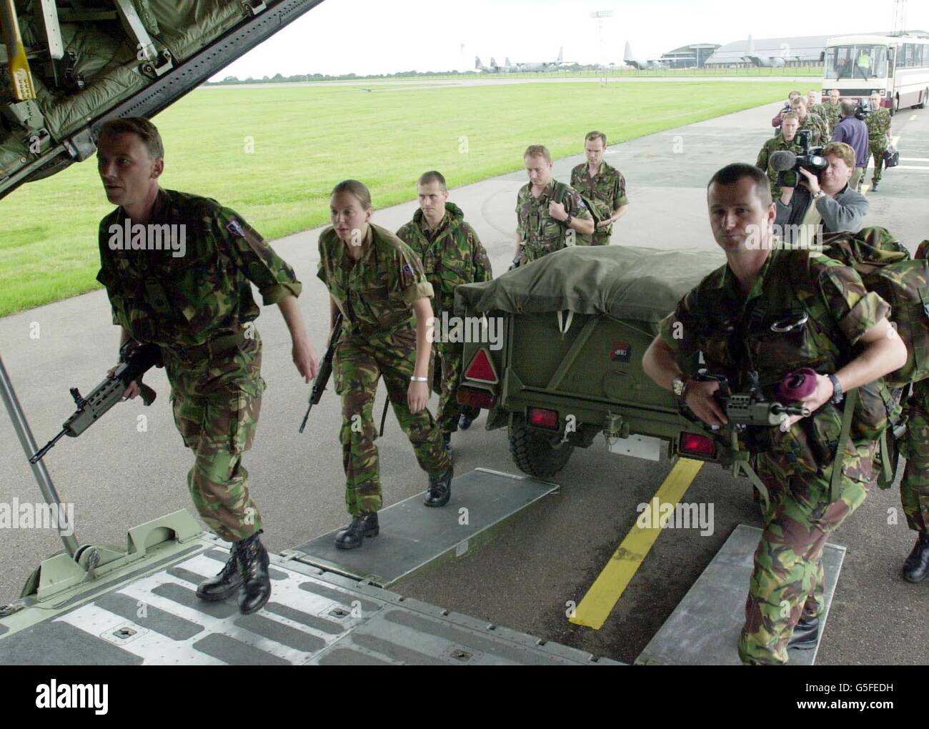 Troops board an RAF Hercules at RAF Lyneham, Wiltshire. Seven Hercules ...