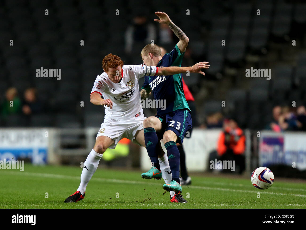 Milton Keynes Dons' Dean Lewington (left) and Sunderland's James ...