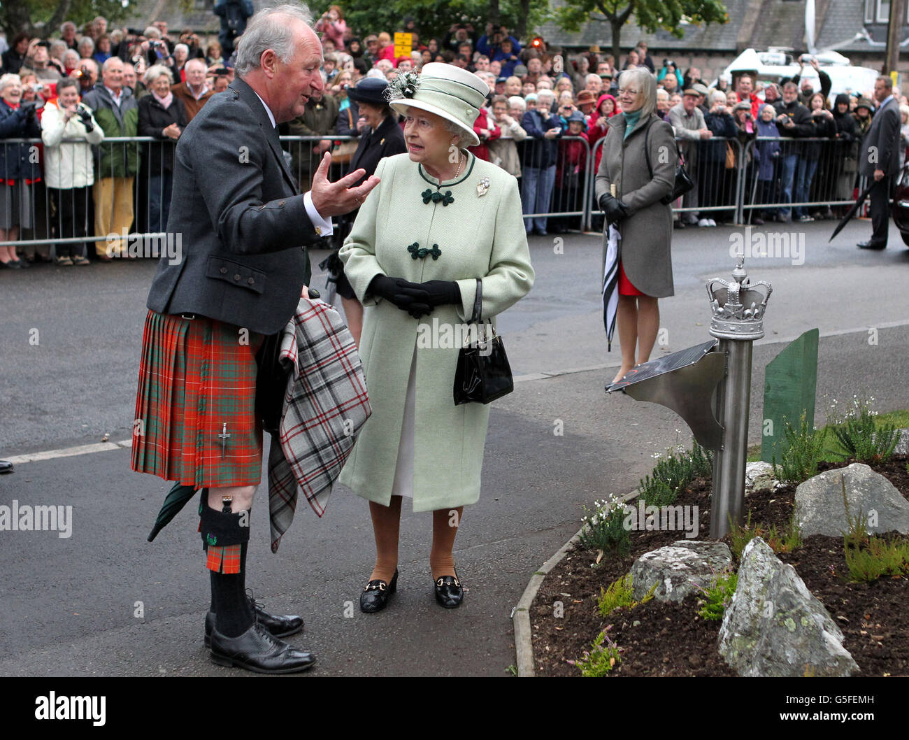 Queen Elizabeth II, talks to Gordon Bruce, in Ballater, Aberdeenshire ...