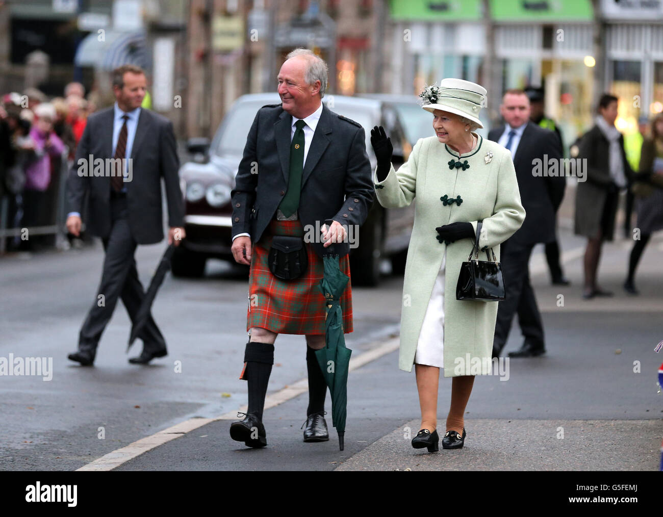 Queen Elizabeth II, walks with Gordon Bruce, in Ballater, Aberdeenshire ...