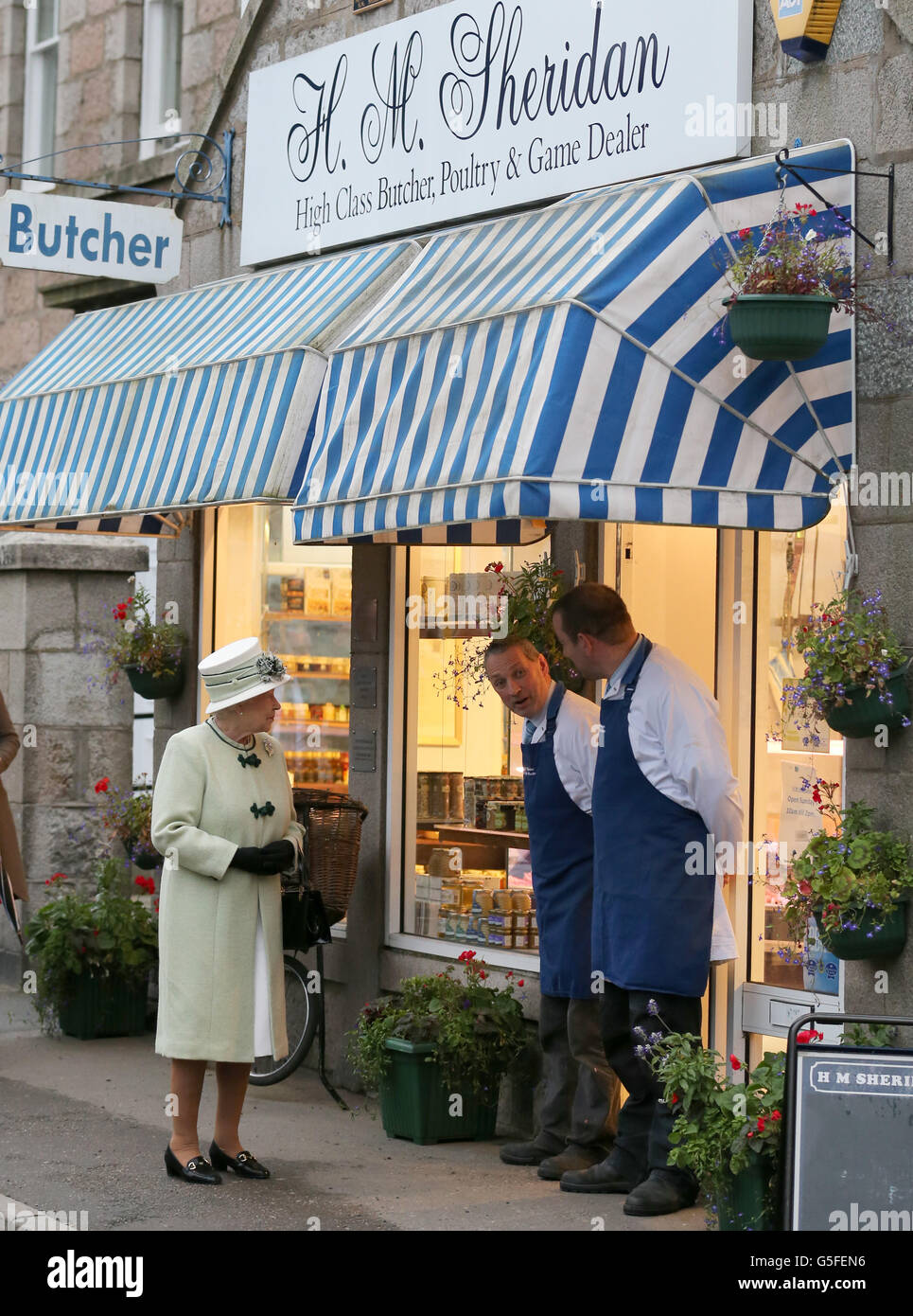 Queen Elizabeth II, talks to the local butchers, in Ballater ...