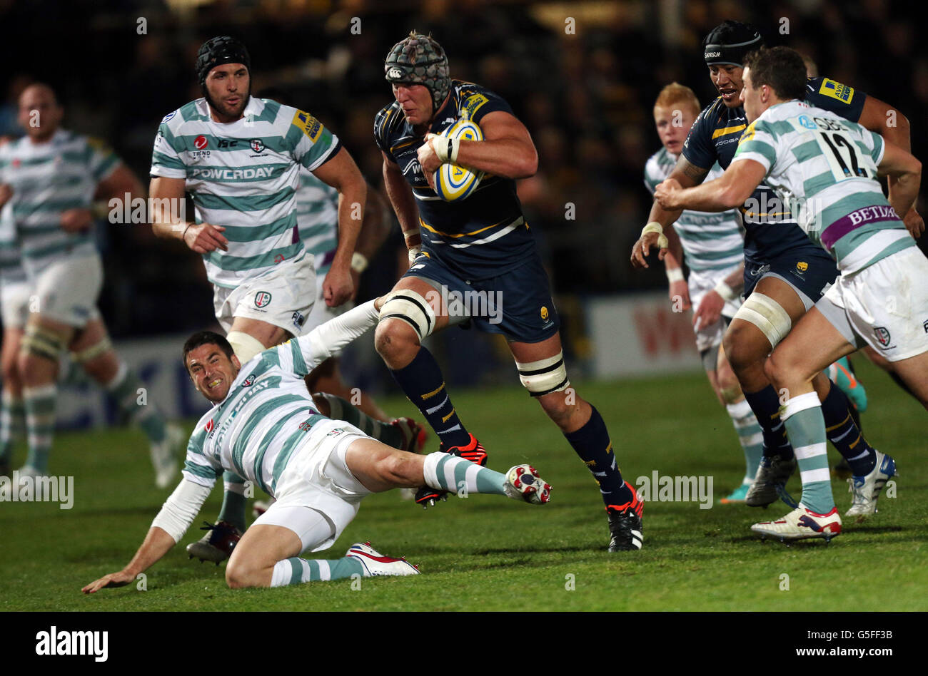 Worcester's James Percival of runs through the tackle of London Irish's ...