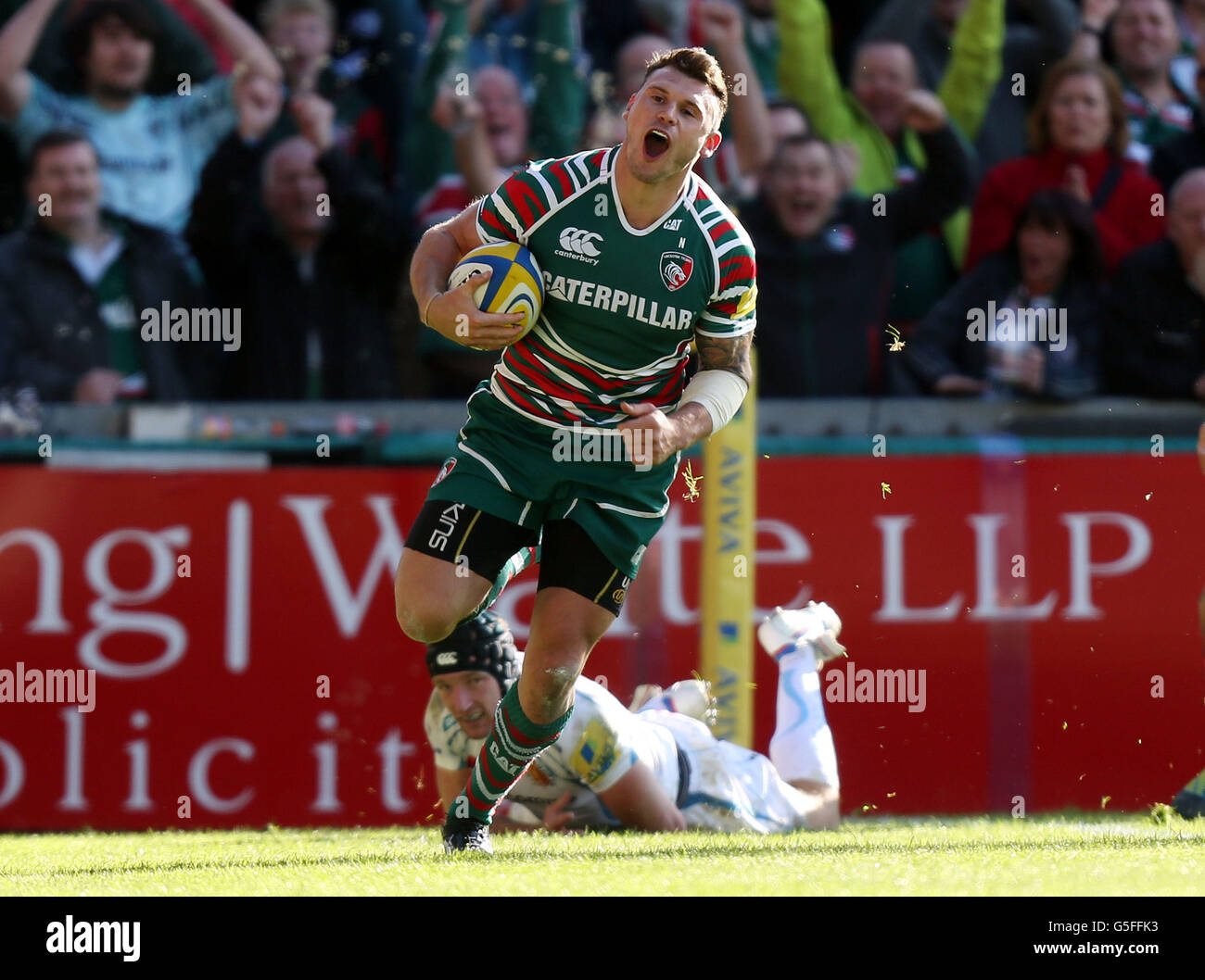 Leicester's Adam Thompstone runs in his third try during the Aviva ...