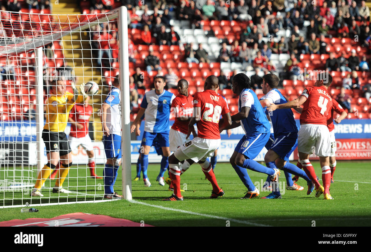 Leon Cort of Charlton sees this header saved on the line by Paul ...