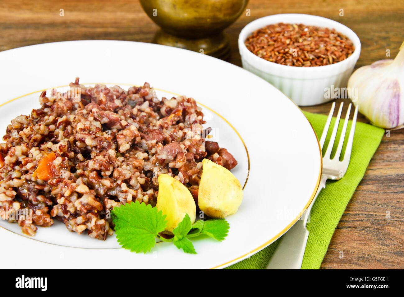 Pilaf with Meat, Carrots and Red Rice Stock Photo - Alamy