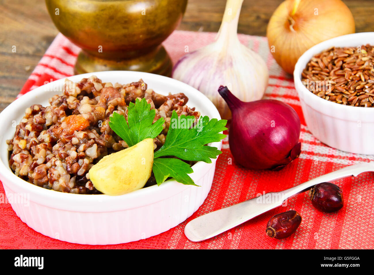 Pilaf with Meat, Carrots and Red Rice Stock Photo - Alamy