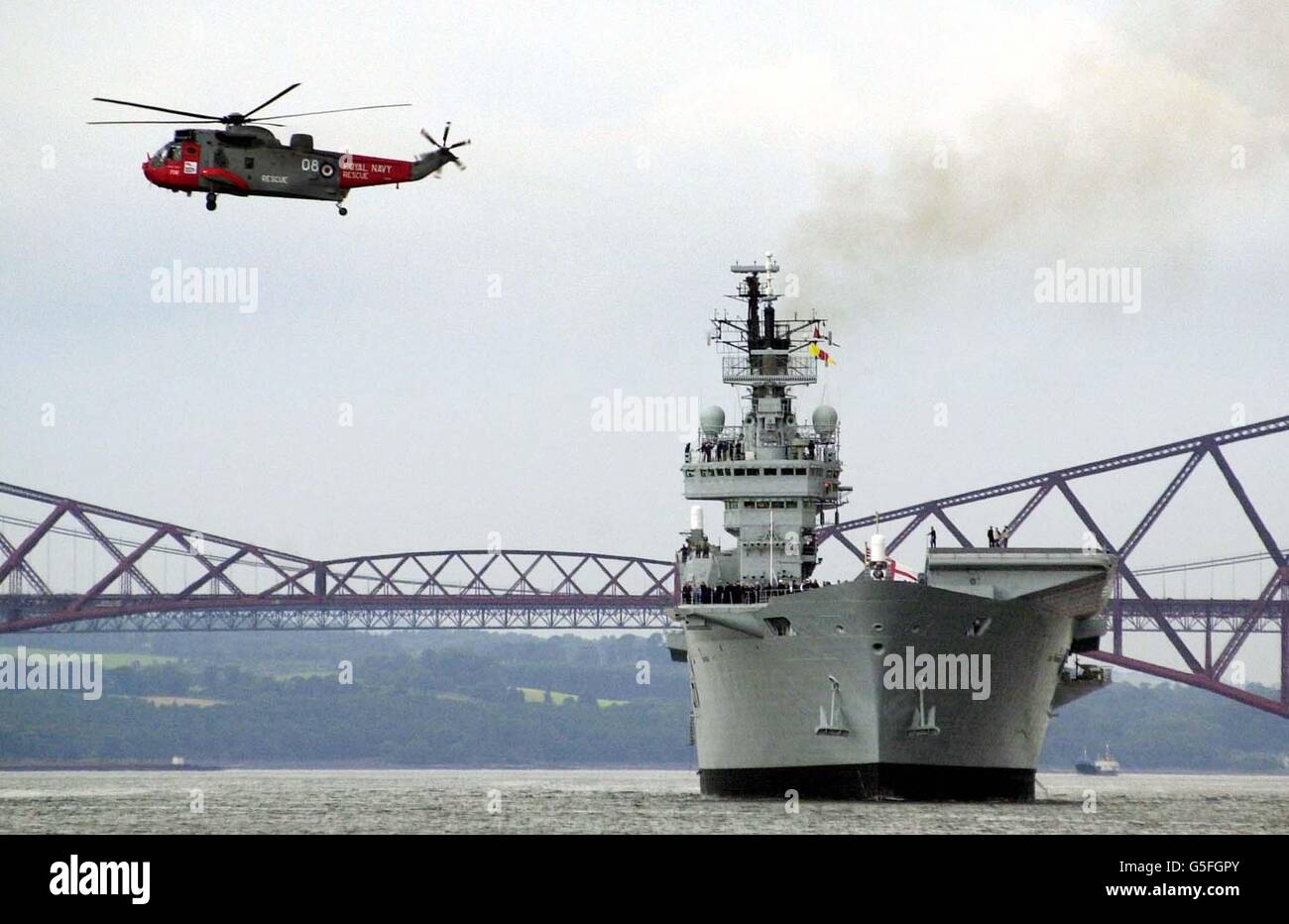 The HMS Ark Royal as it leaves Rosyth under the Forth bridge in Fife ...