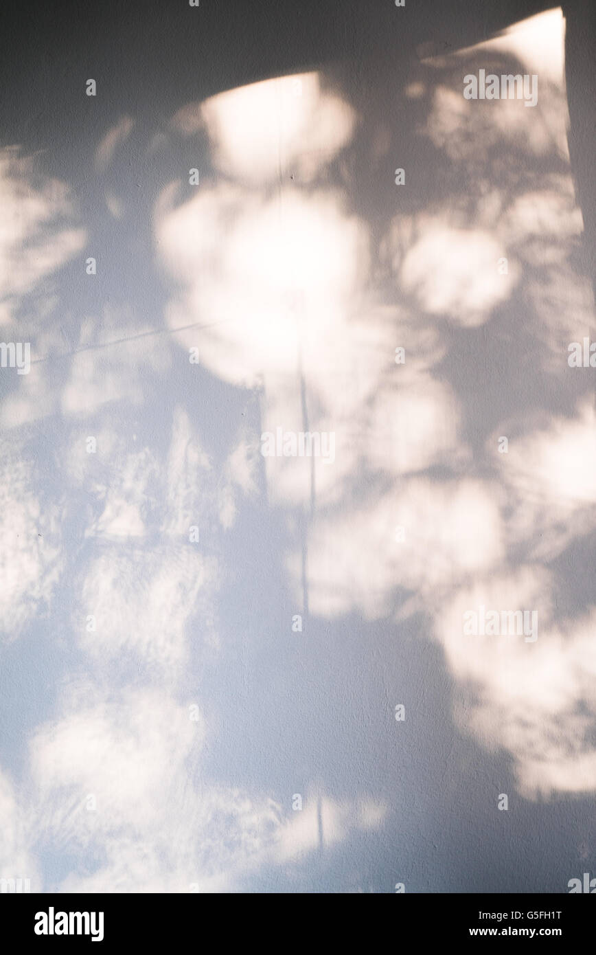 Wall light with shadows Stock Photo - Alamy