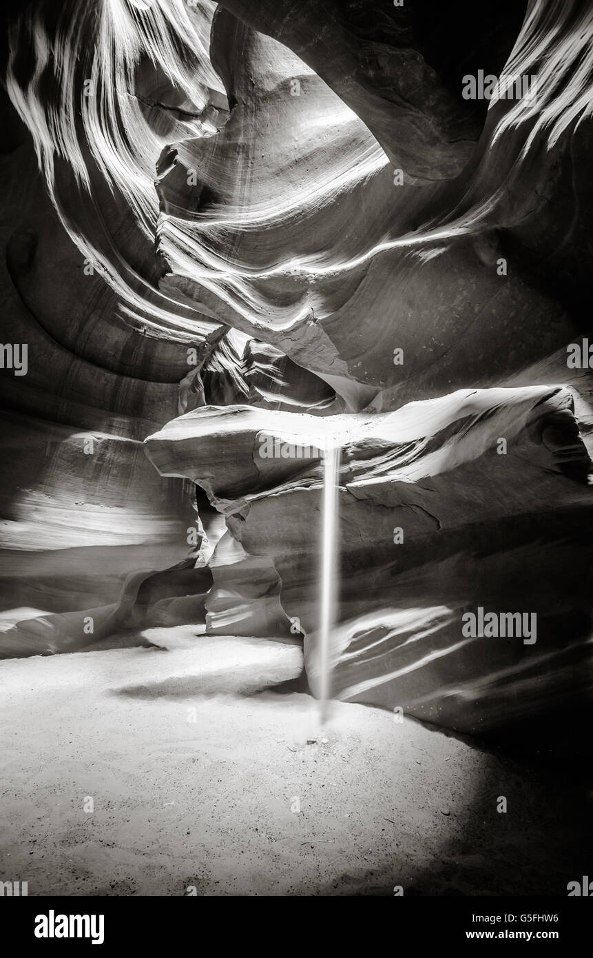 Sun hitting the sand falling from a cliff in Antelope Canyon, Arizona ...