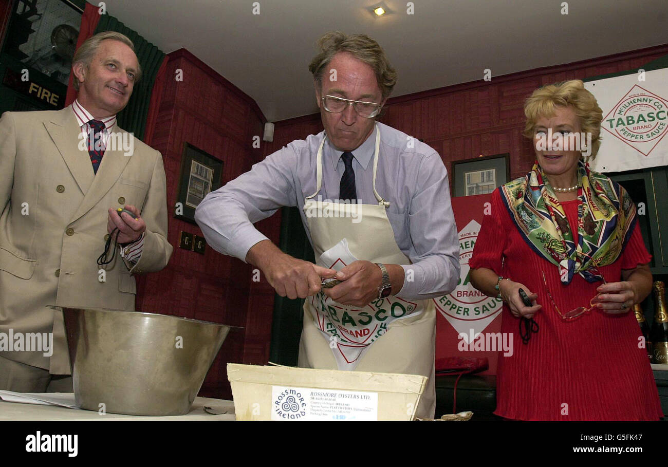 Neil Hamilton (l) and his wife Christine watch David Hugh Jones try his ...