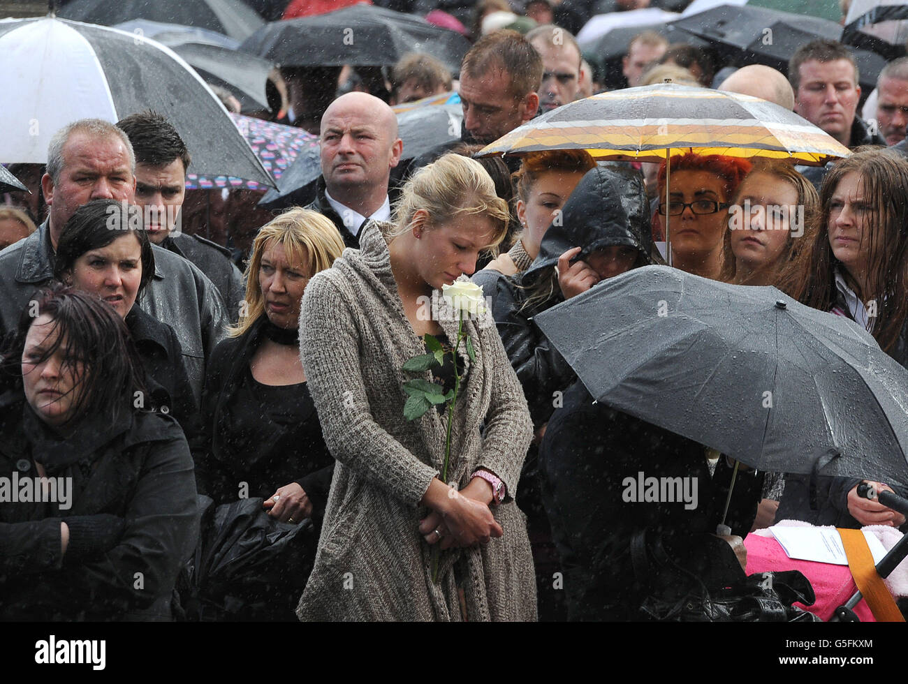 Mourners wait outside church during the funeral service of Private ...