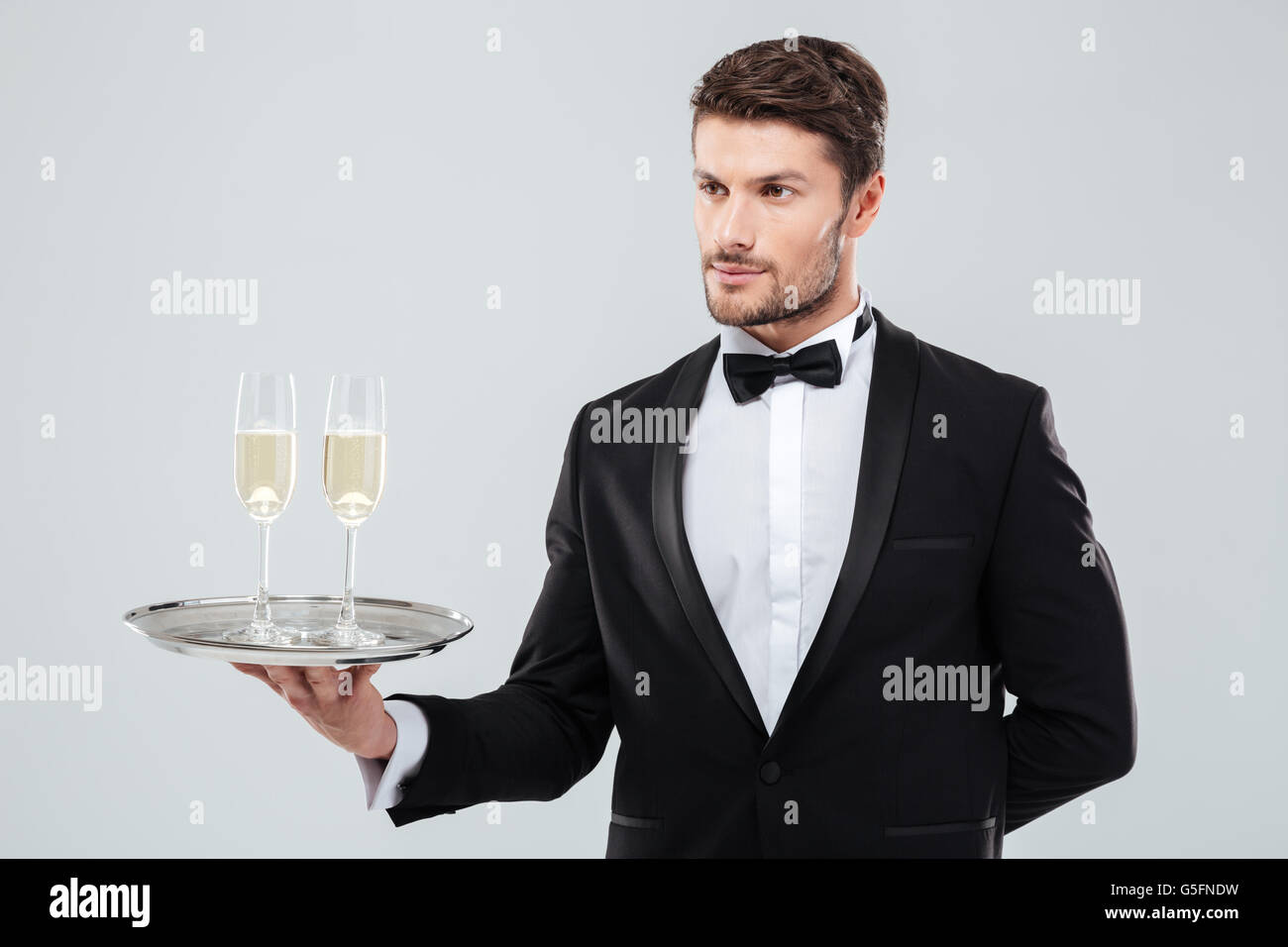 Butler holding silver tray hi-res stock photography and images - Alamy