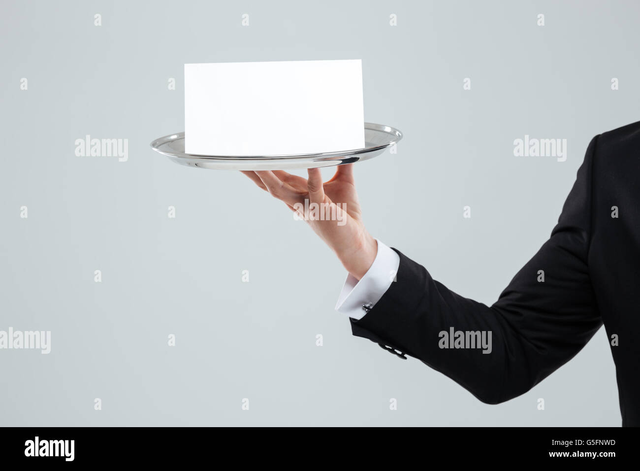 Male waiter in suit hi-res stock photography and images - Alamy