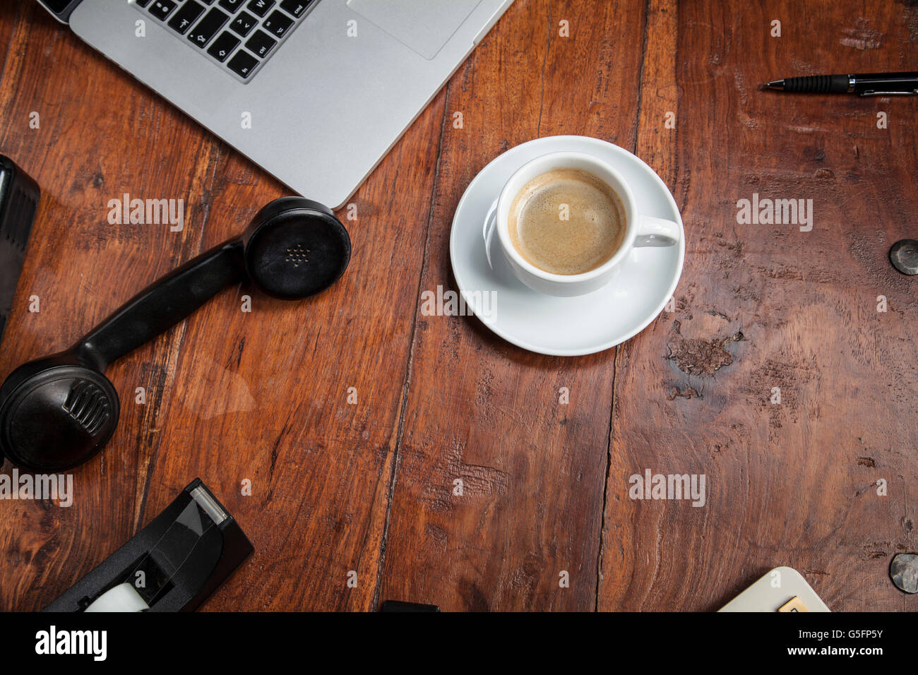 coffee and phone on the office desk Stock Photo - Alamy