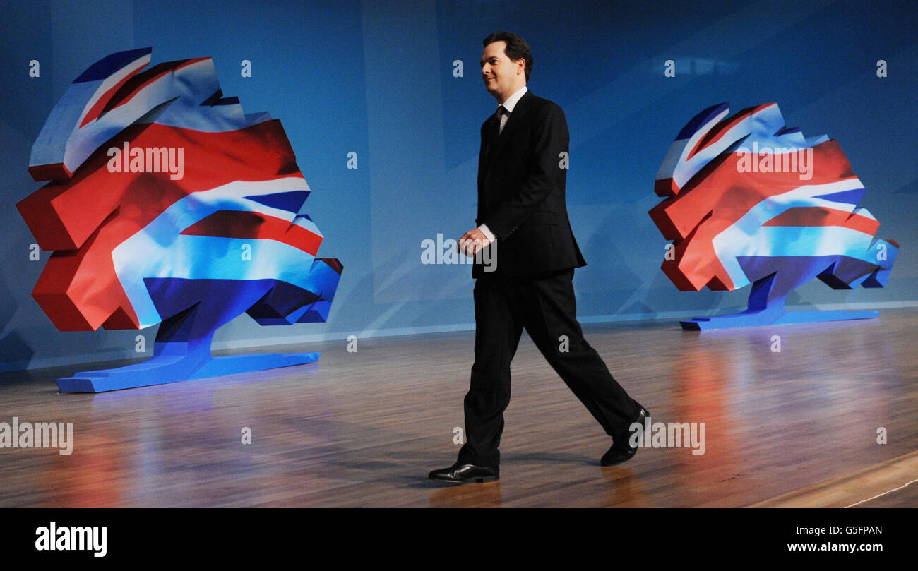Chancellor George Osborne leaves the stage after addressing the ...